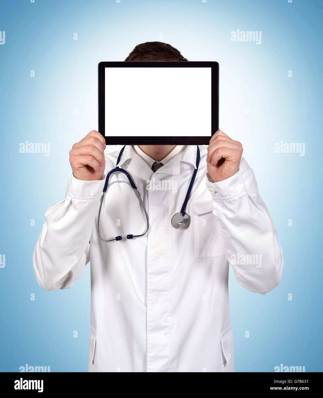 doctor holding blank tablet on a blue background Stock Photo - Alamy