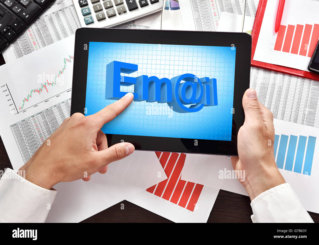 hands using tablet pc with email on screen Stock Photo - Alamy