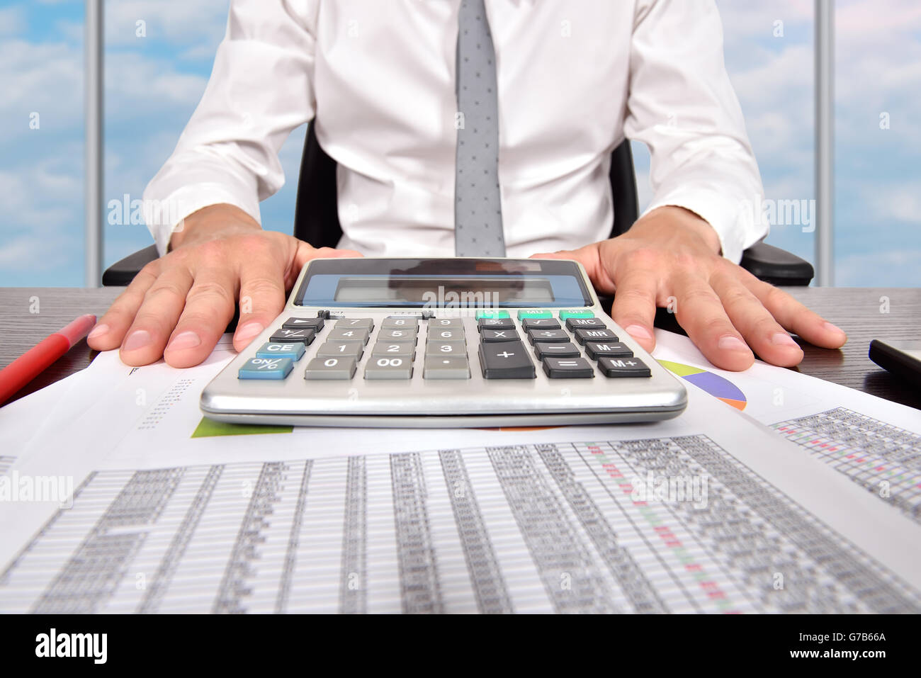 accountant man with financial report sitting in office Stock Photo - Alamy