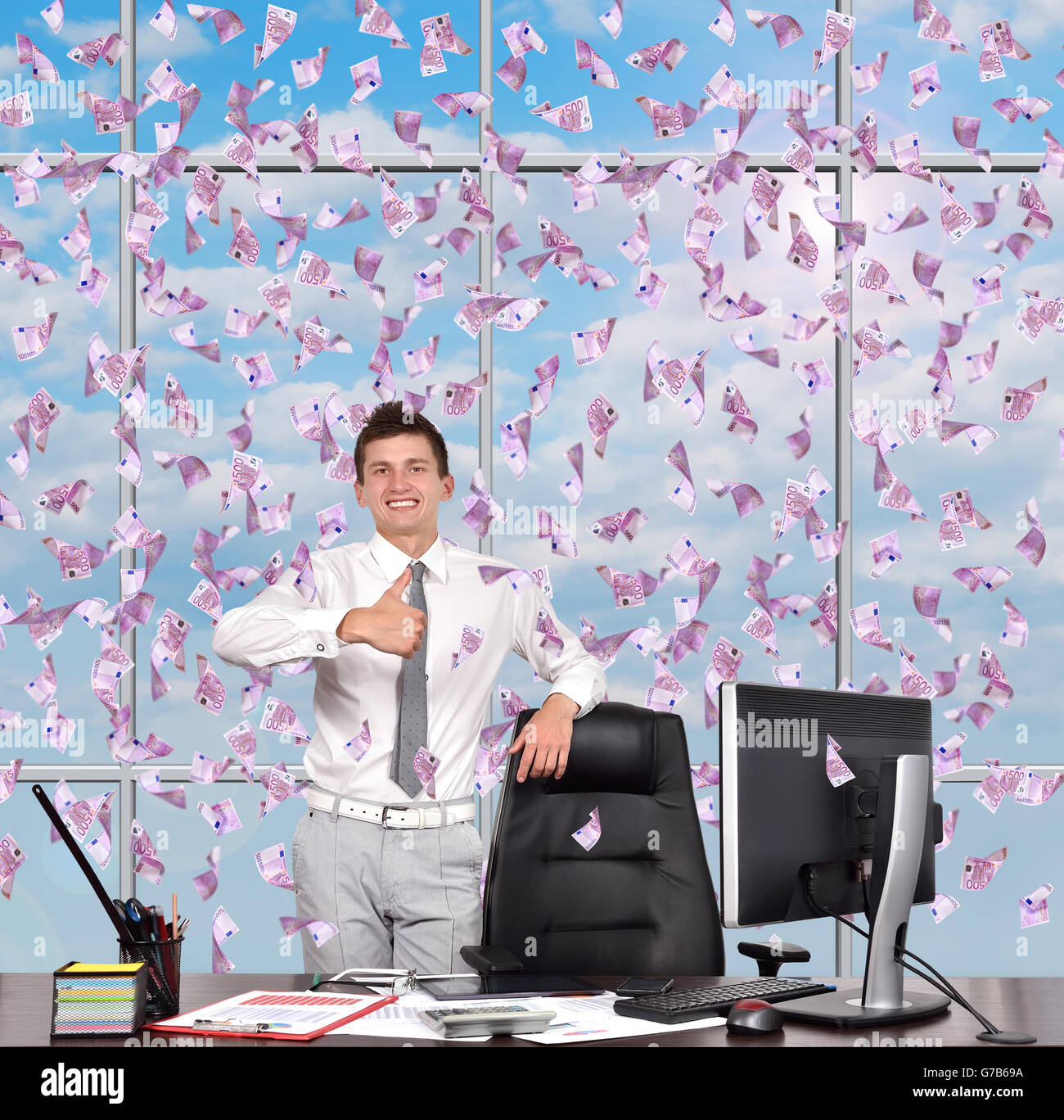 businessman showing thumb up and falling euro banknote Stock Photo - Alamy