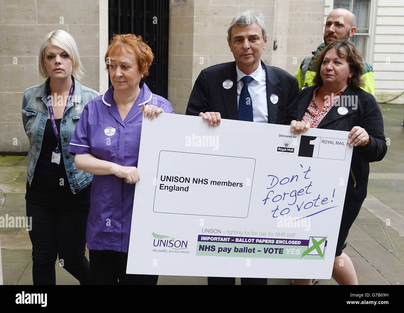 Health worker Mary Locke (in purple), from Birmingham, accompanies ...