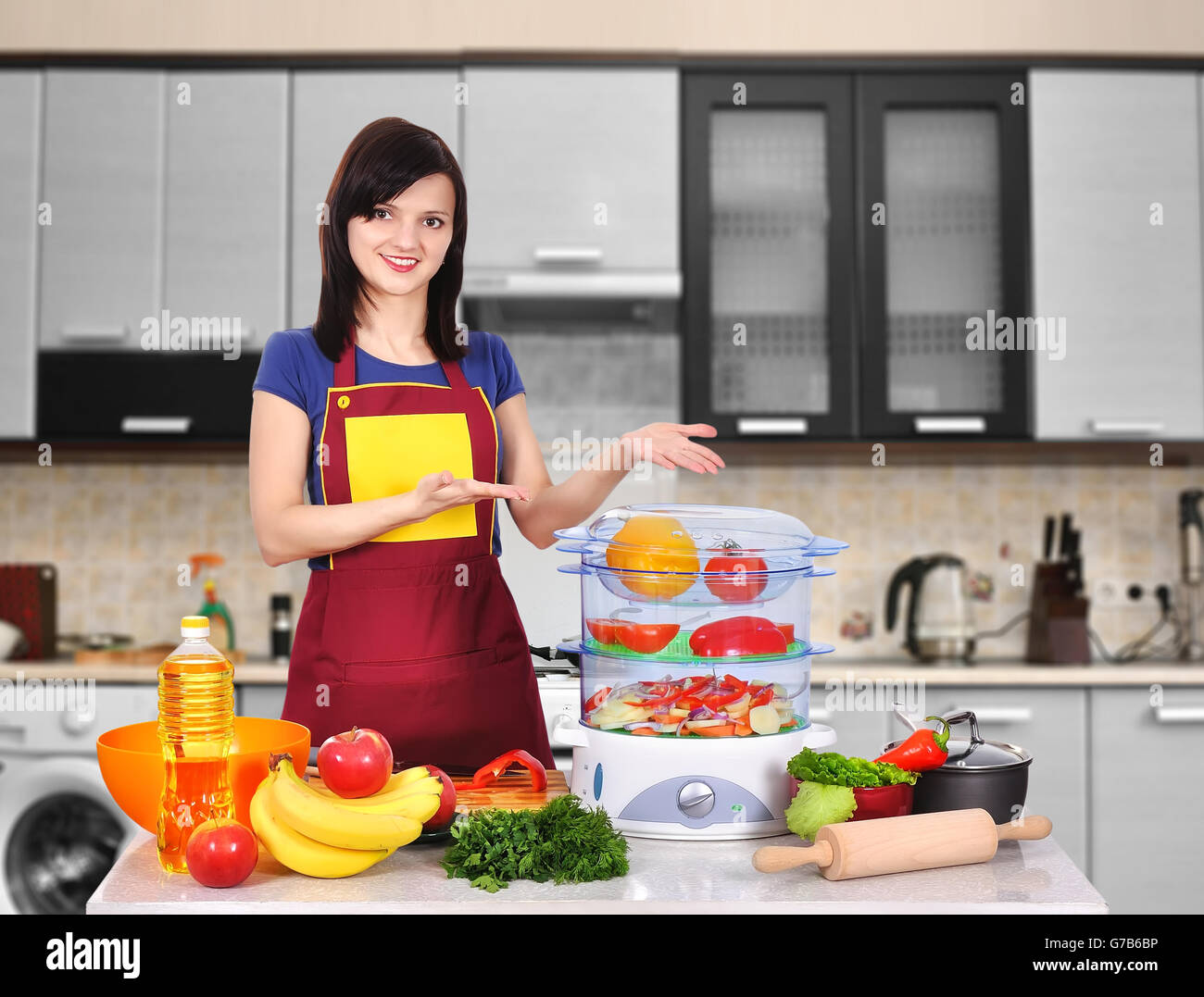 happy woman chef showing cooked dish Stock Photo - Alamy