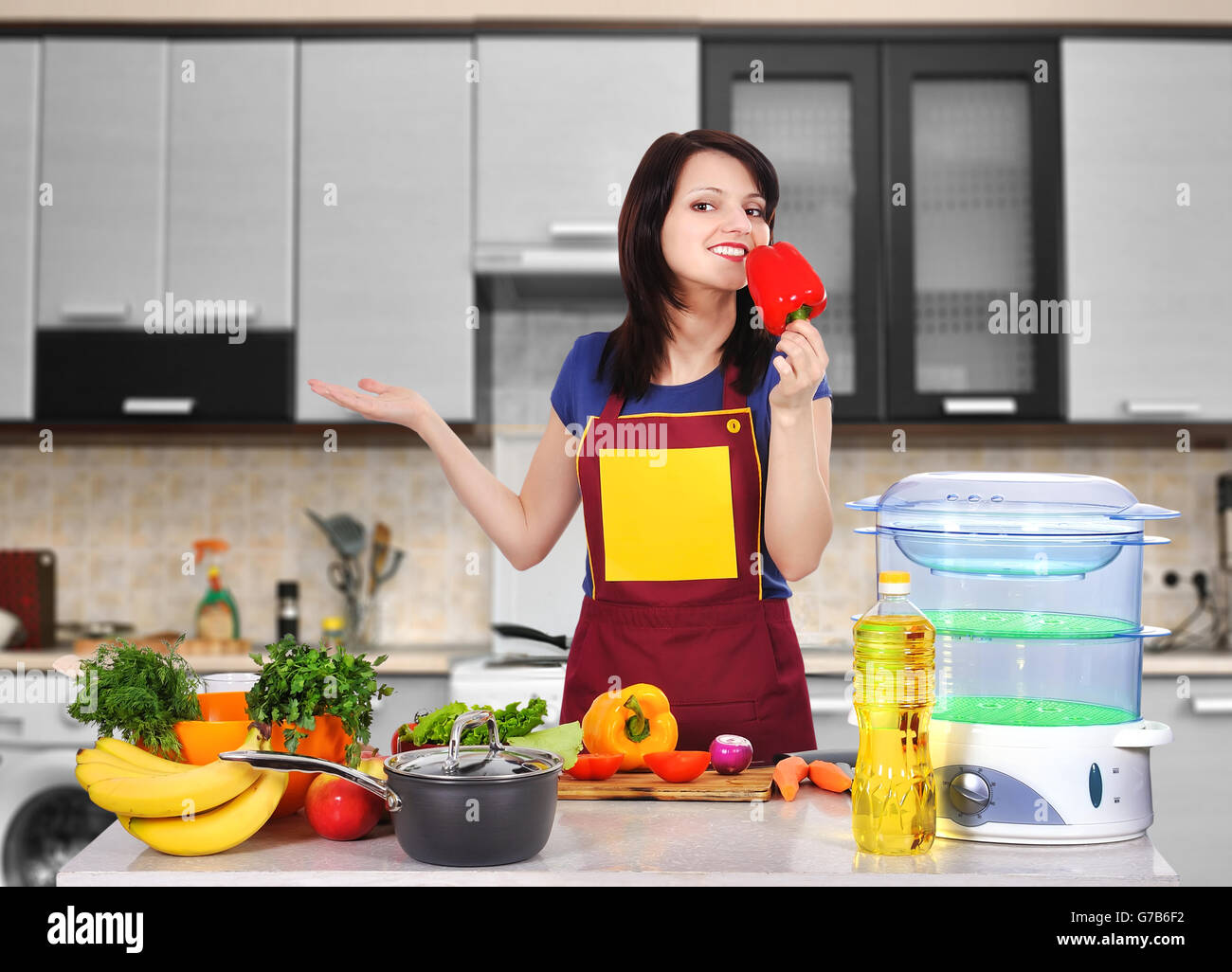 chef girl enjoys the smell of pepper Stock Photo - Alamy