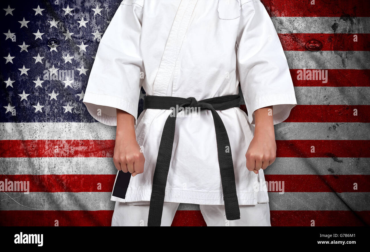 Karate boy in kimono on american flag background Stock Photo - Alamy