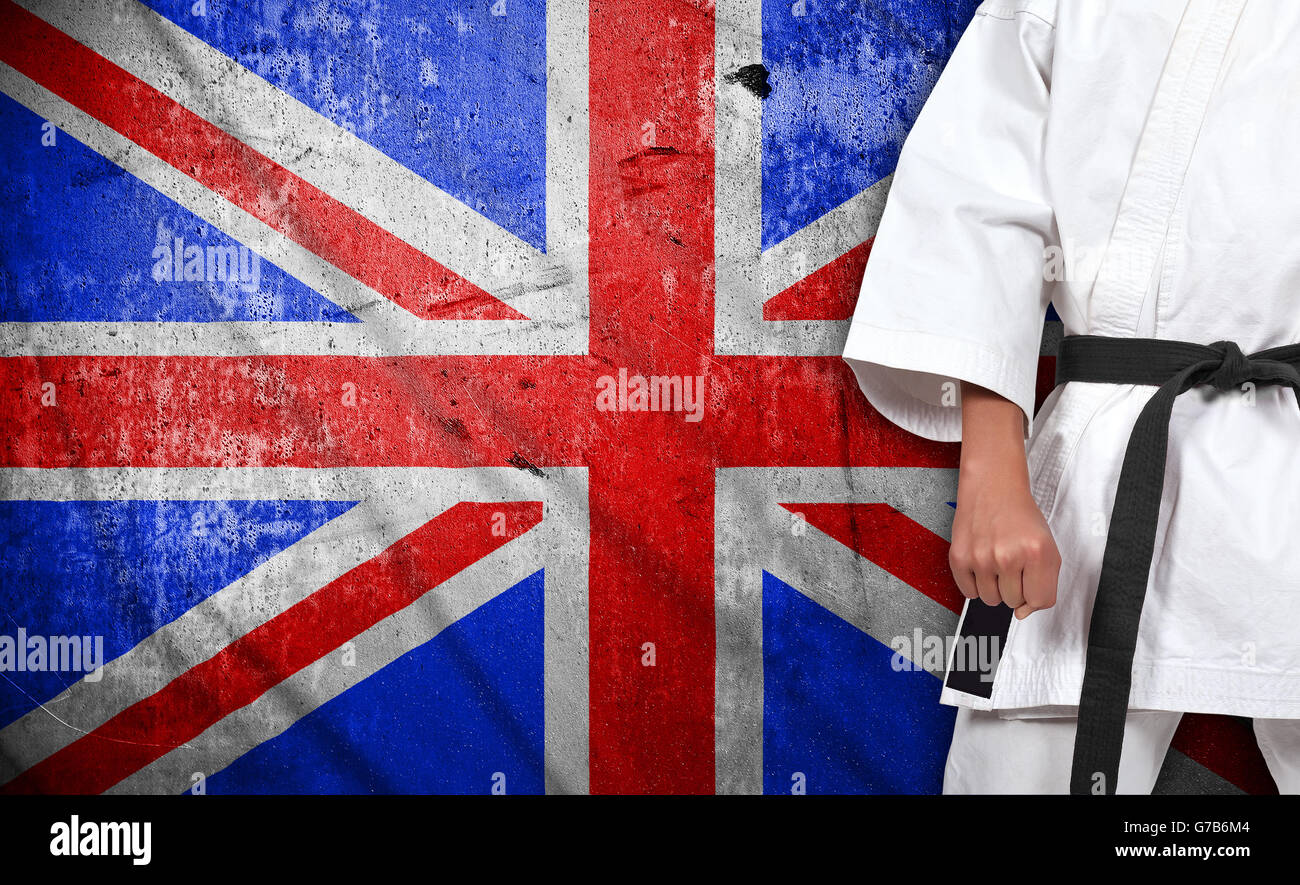 Karate boy in kimono on united kingdom flag background Stock Photo - Alamy