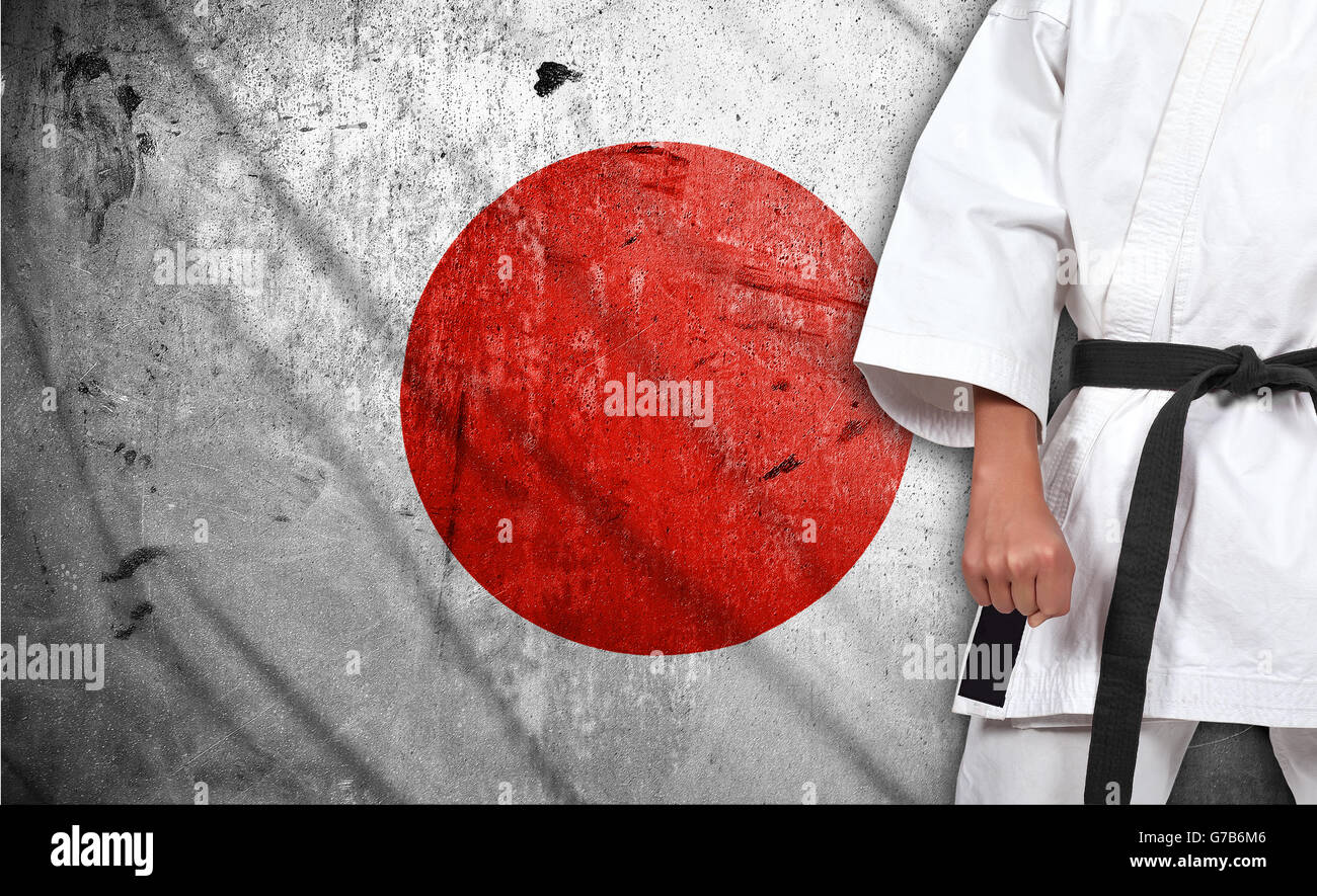 Karate boy in kimono on japan flag background Stock Photo - Alamy