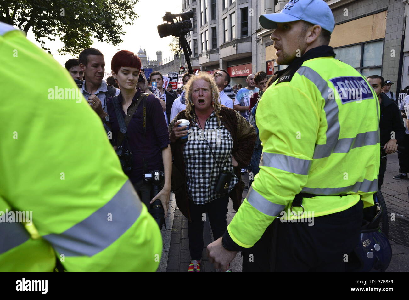 Protesters are stopped by a police cordon near Cardiff Castle in ...