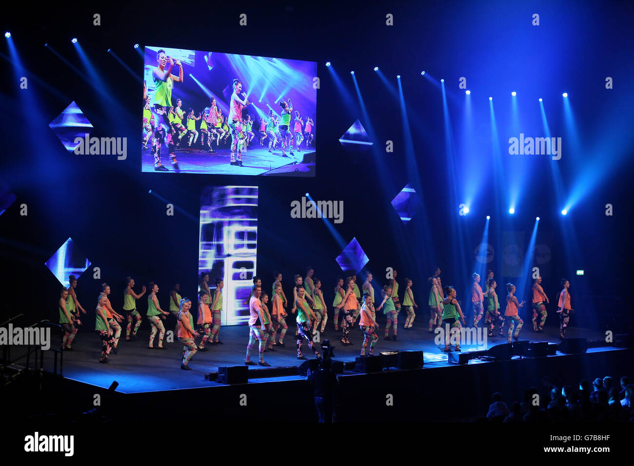 Performers on stage at the Opening Ceremony at the Phones 4u Arena ...
