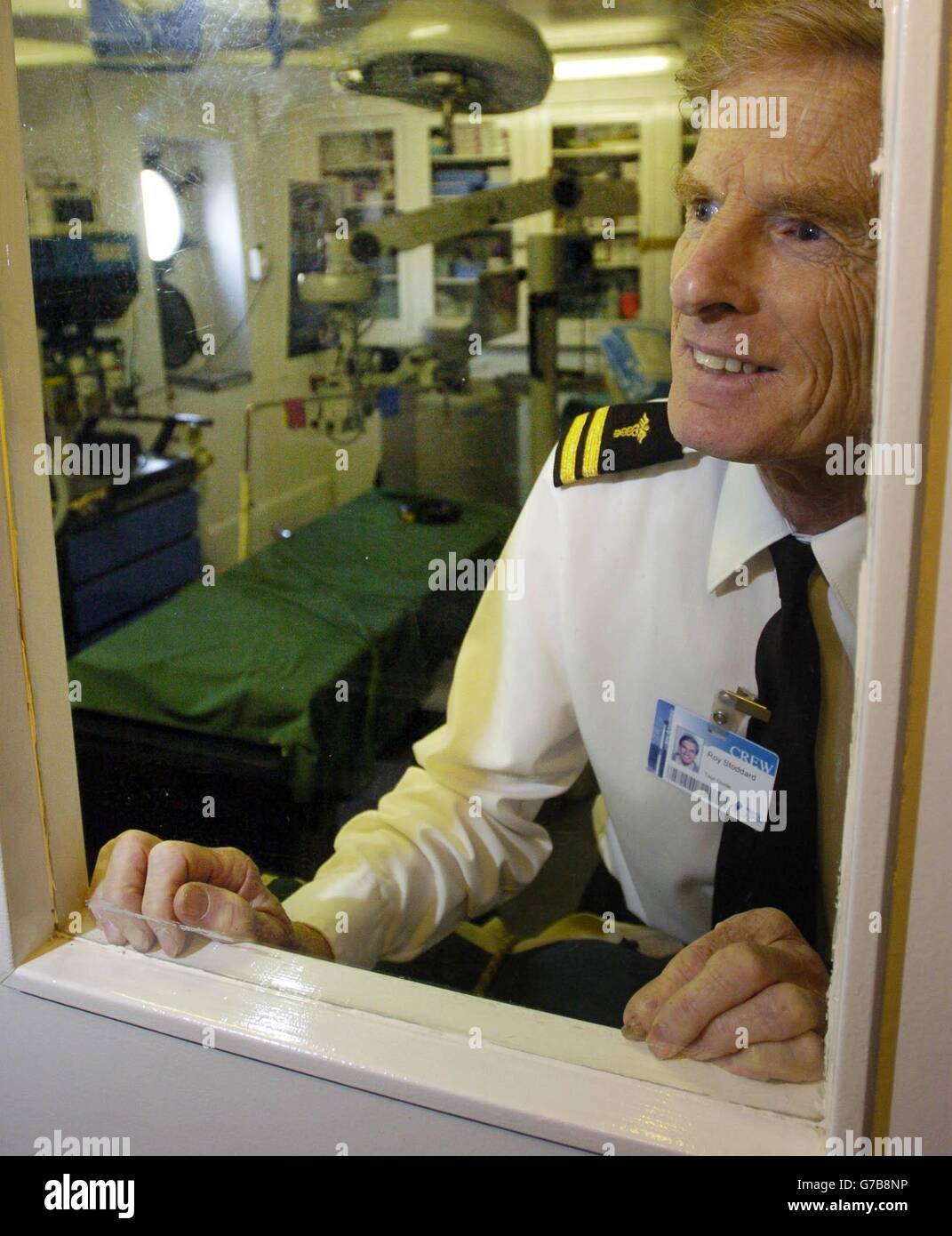 Dr roy stoddard looks out operating room on board hi-res stock ...