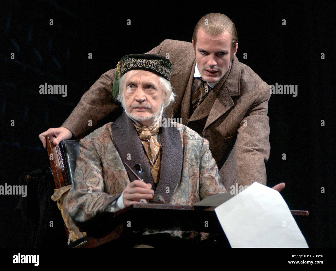 Actors Edward Petherbridge as Mr Fairlie (seated) and Oliver Darley as ...