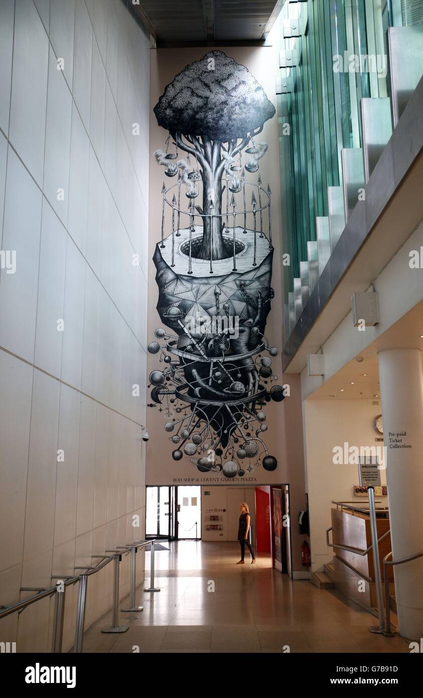 A visitor to the Royal Opera House in Covent Garden, London, walks ...