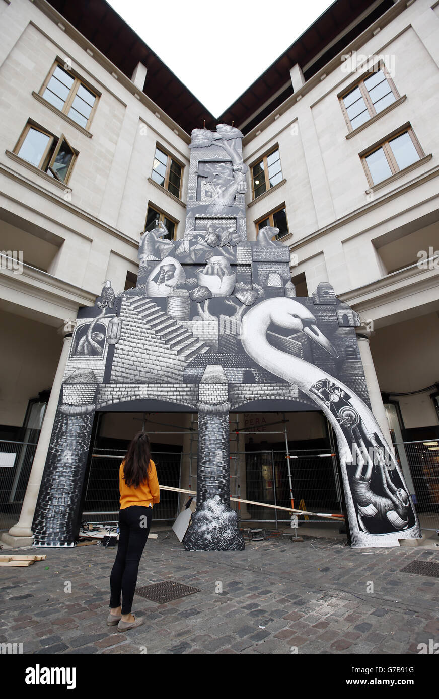 A visitor to Covent Garden, London, admires a new installation of a ...