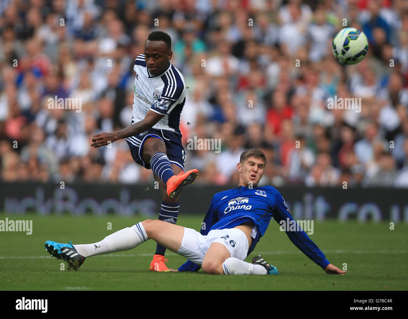 West Bromwich Albion's Saido Berahino (left) battles for the ball with ...