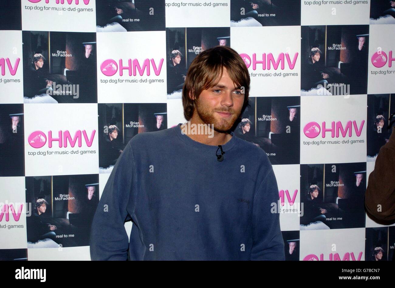 Brian McFadden signs copies of his debut single Stock Photo - Alamy