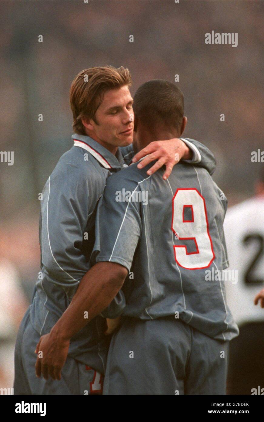 England's Les Ferdinand is congratulated by David Beckham Stock Photo ...