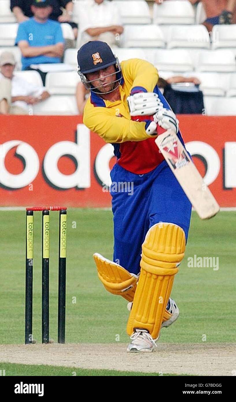 Essex batsman Ronnie Irani hits off Glamorgan bowler David Harrison ...