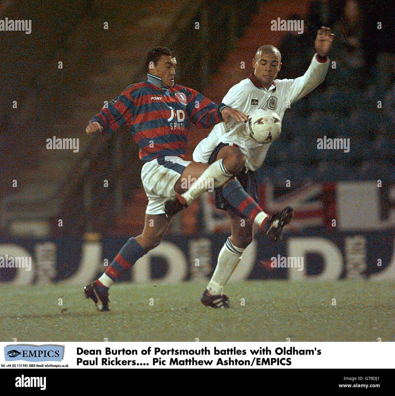 Dean Burton of Portsmouth battles with Oldham's Paul Rickers Stock ...