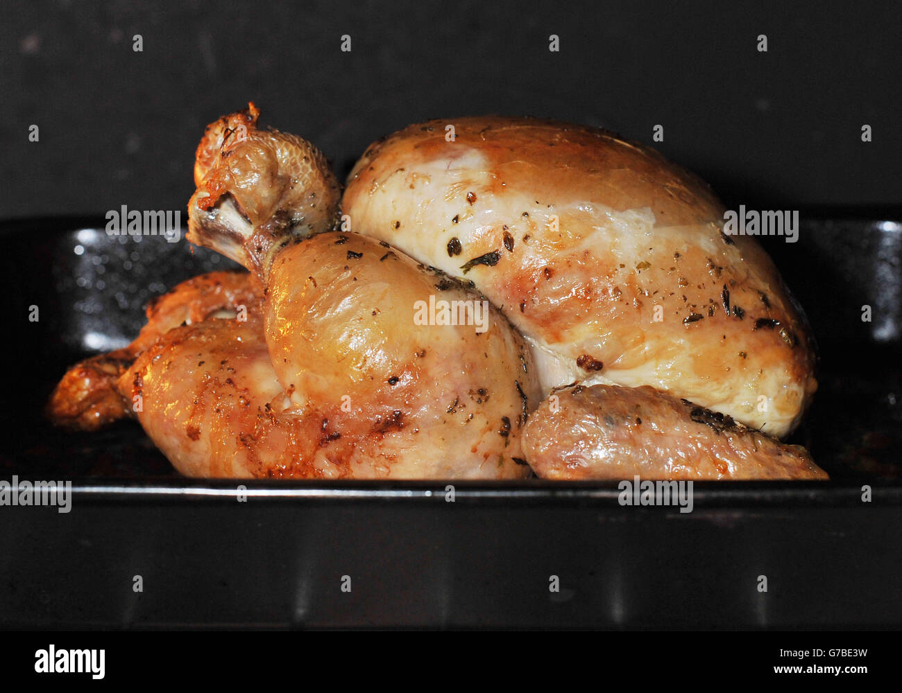 A chicken being roasted in a household oven, as poor food hygiene ...