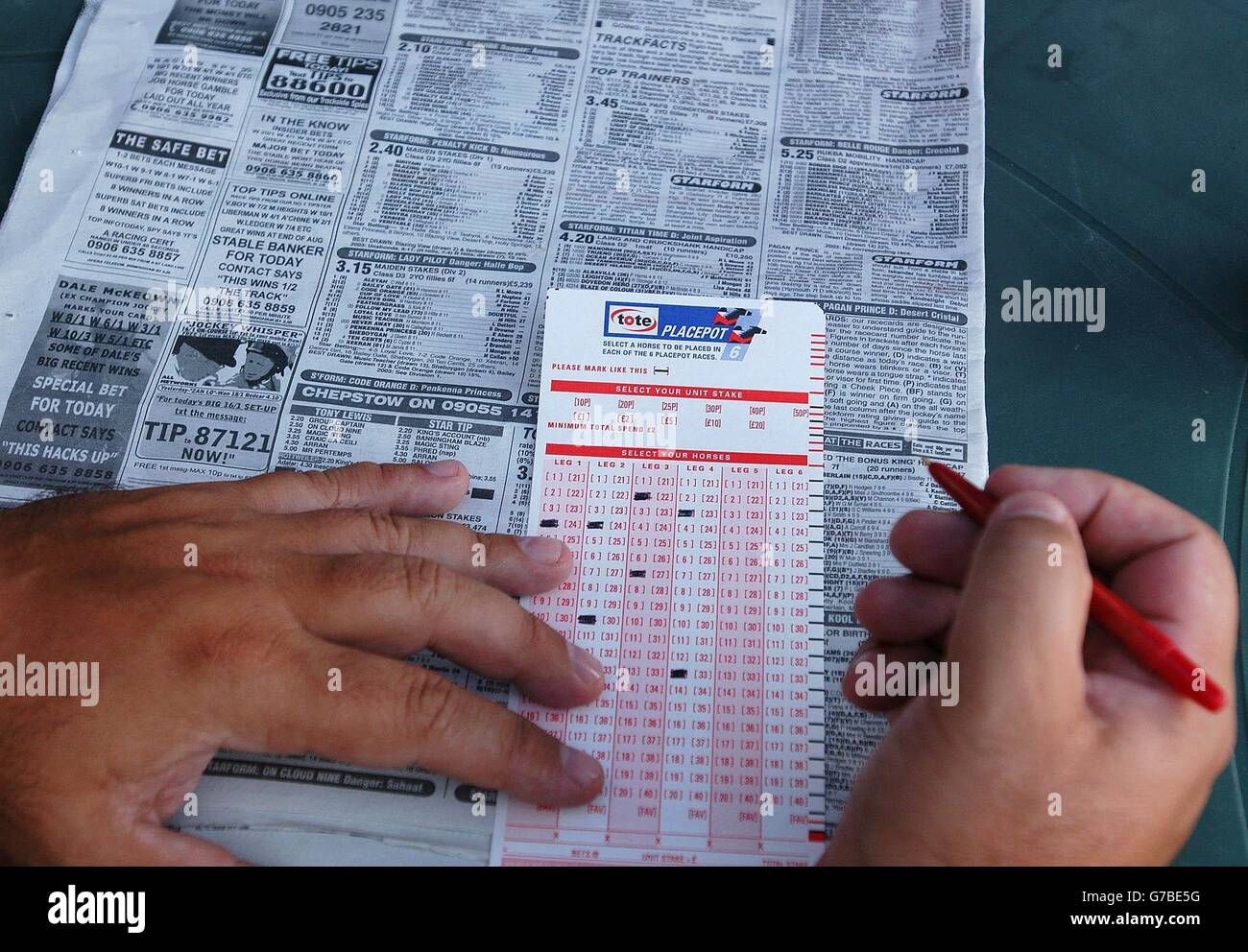 Filling out betting slip Stock Photo - Alamy