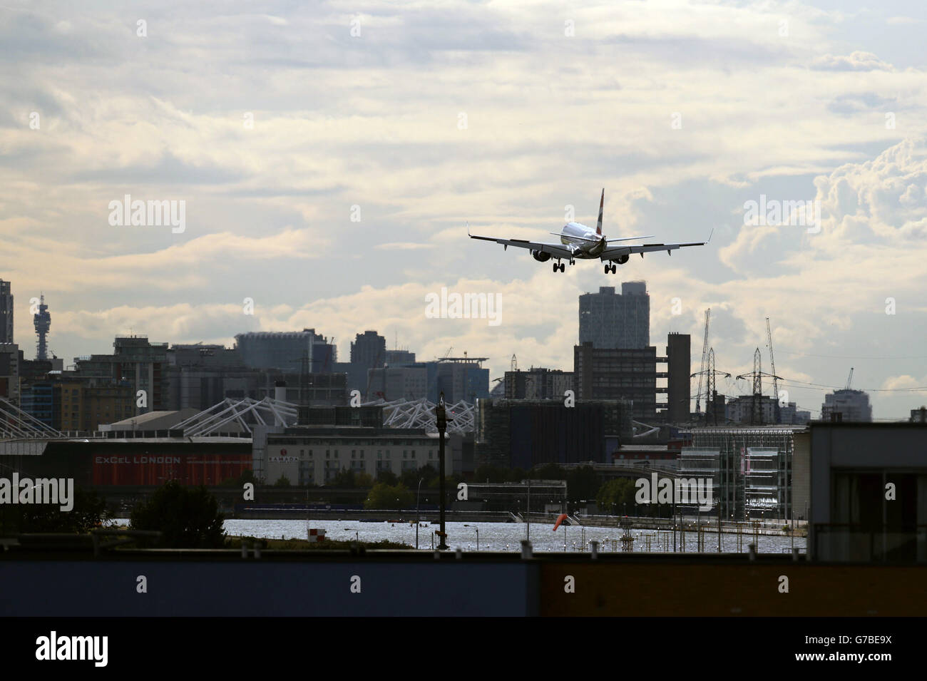 Plane making final approach to land at city airport hi-res stock ...