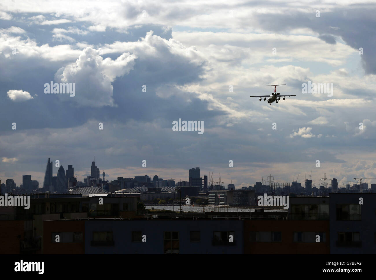 A plane making a final approach to land at City Airport, in east London ...