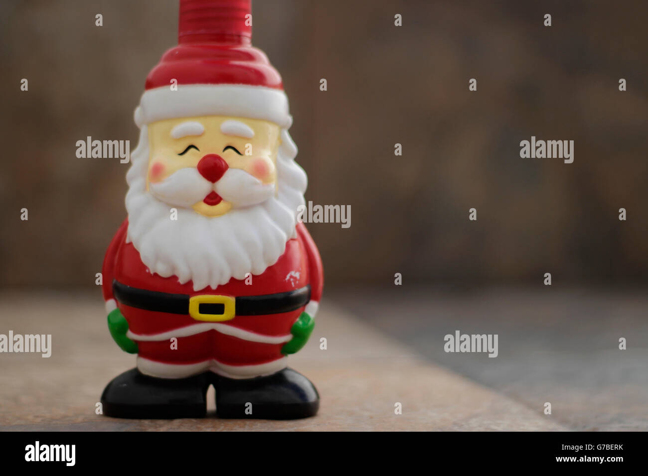 Photograph of a Santa Claus toy with a blurred background Stock Photo ...