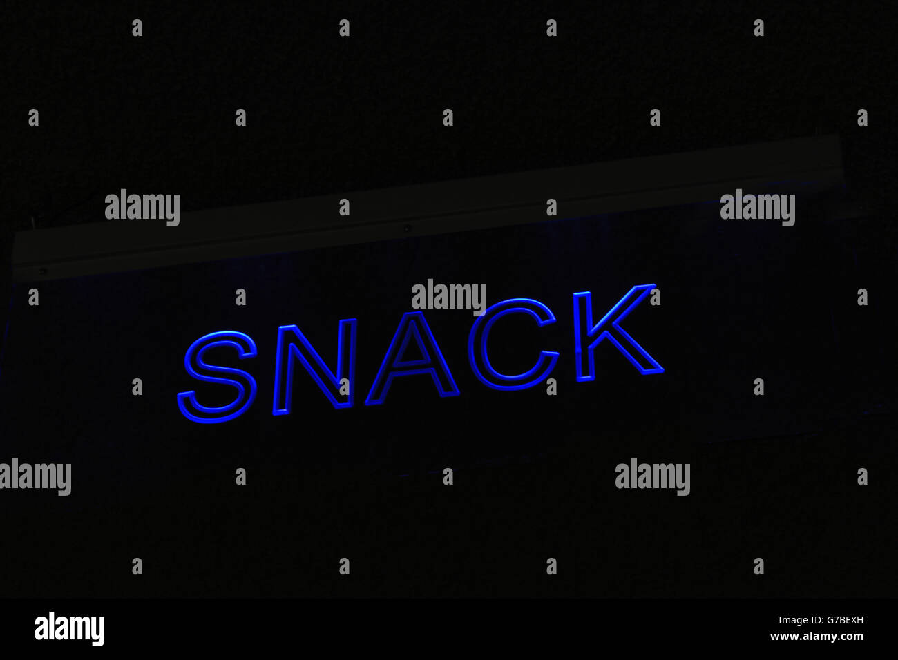 Photograph of a snack blue neon sign Stock Photo - Alamy