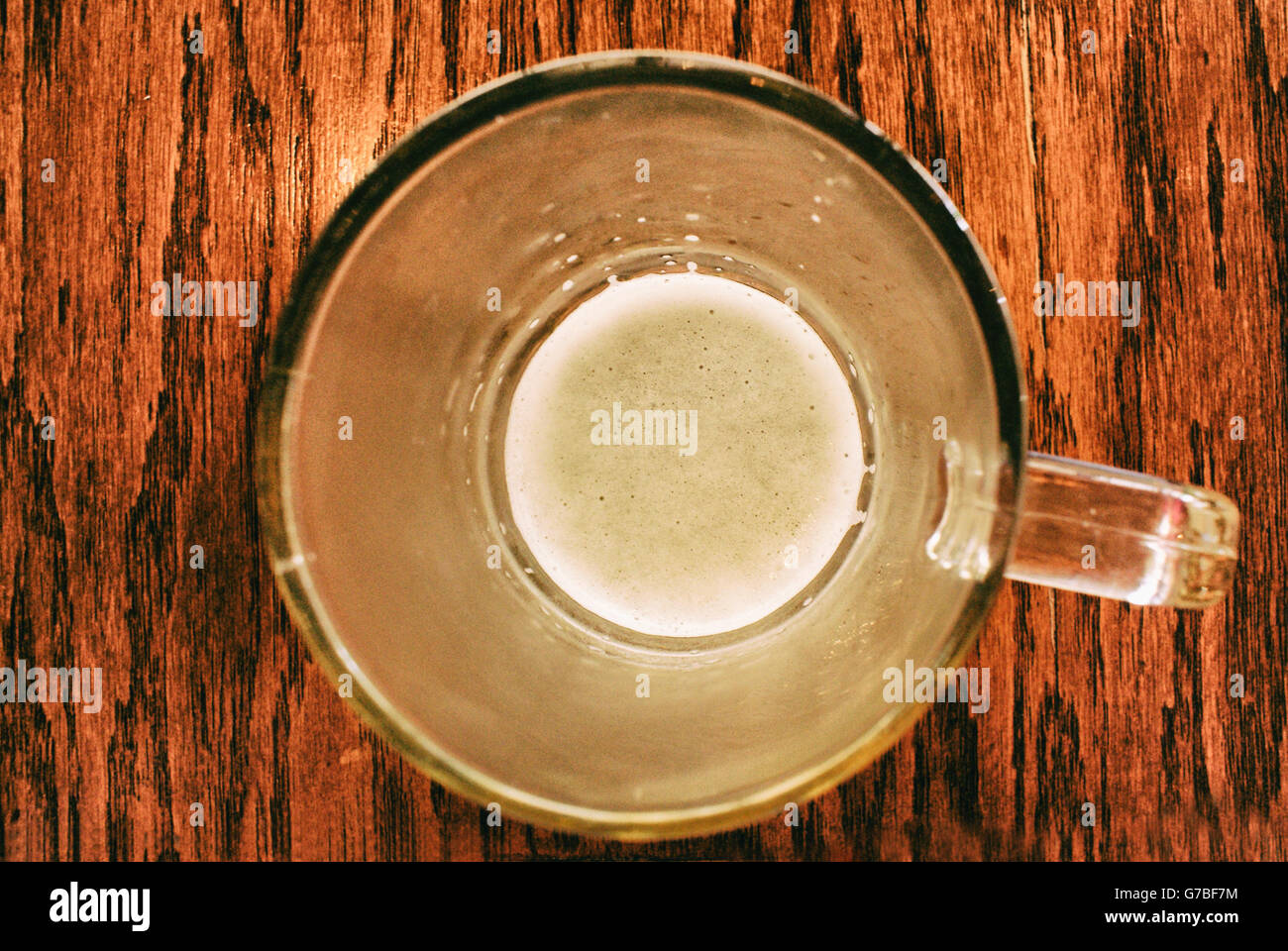 Photograph of a Jar of beer on a wood table from a top view perspective ...