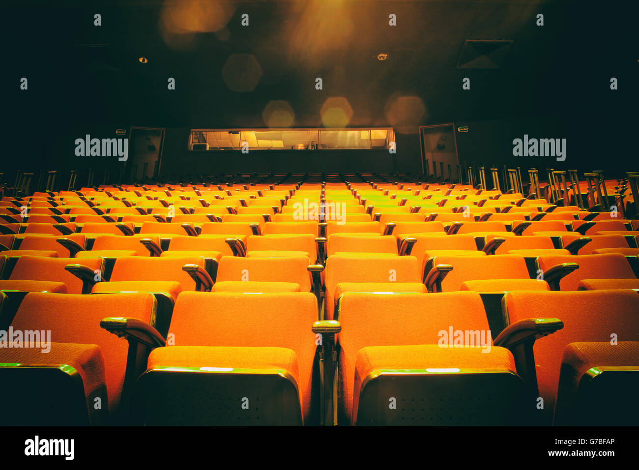 Photograph of an empty theater with red seats Stock Photo - Alamy