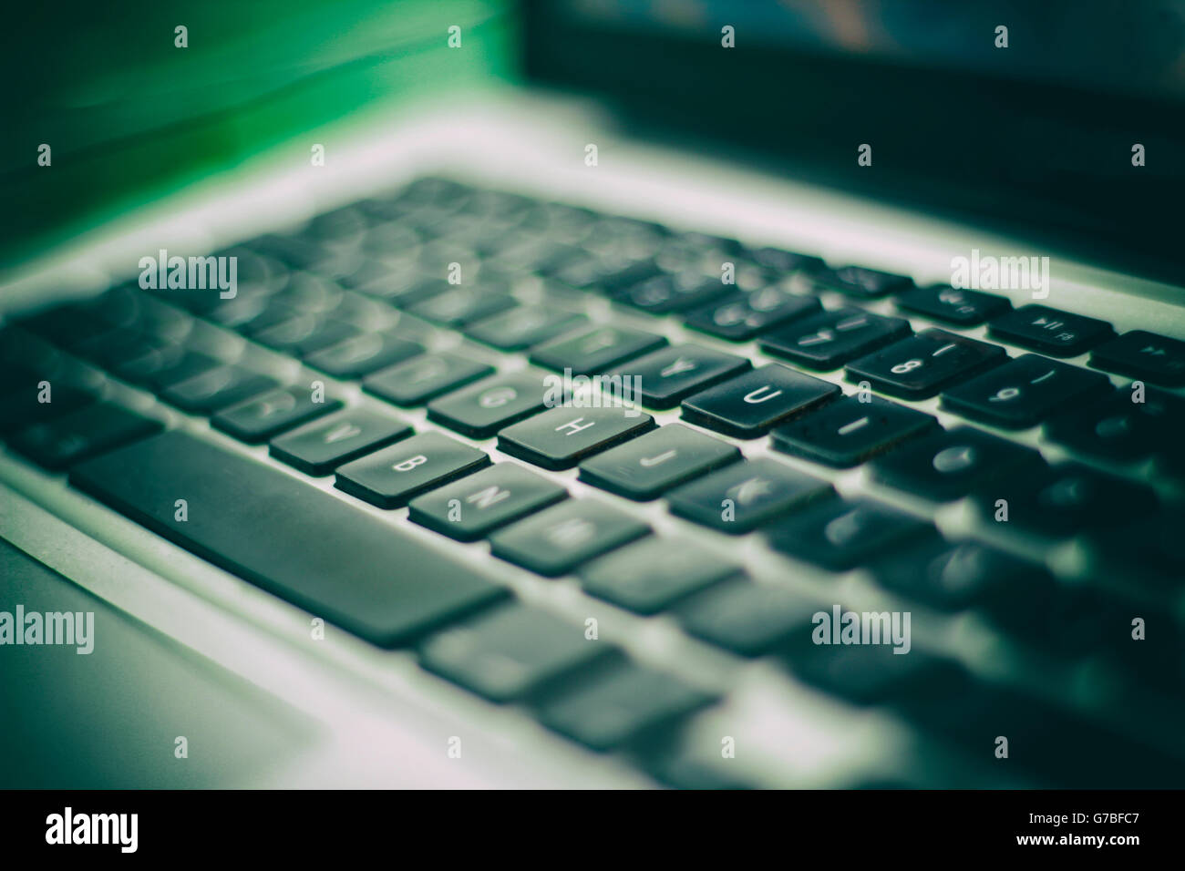 Photograph of a laptop keyboard on a blurred background Stock Photo - Alamy