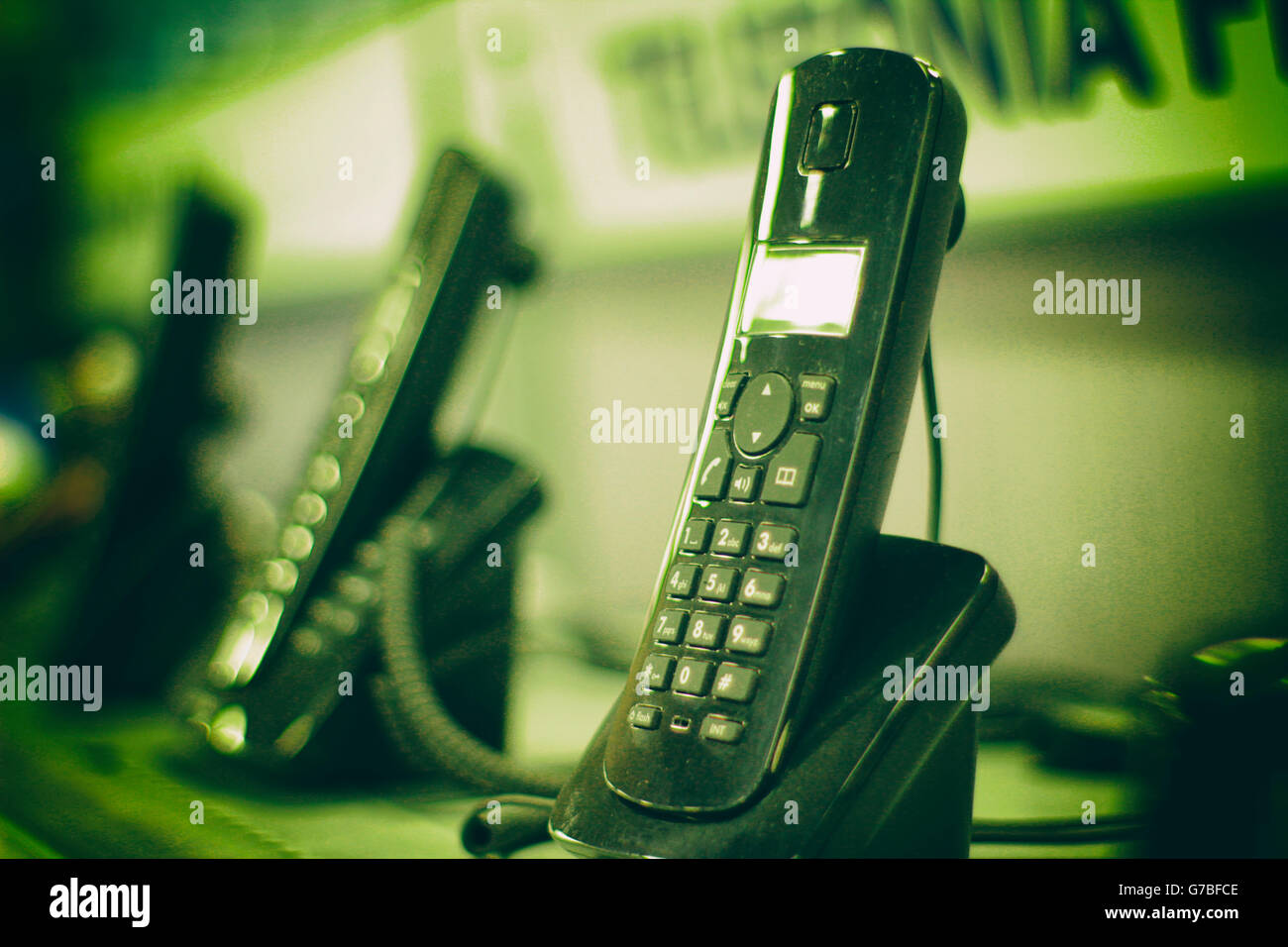 Photograph of some wireless phones on a store counter Stock Photo - Alamy