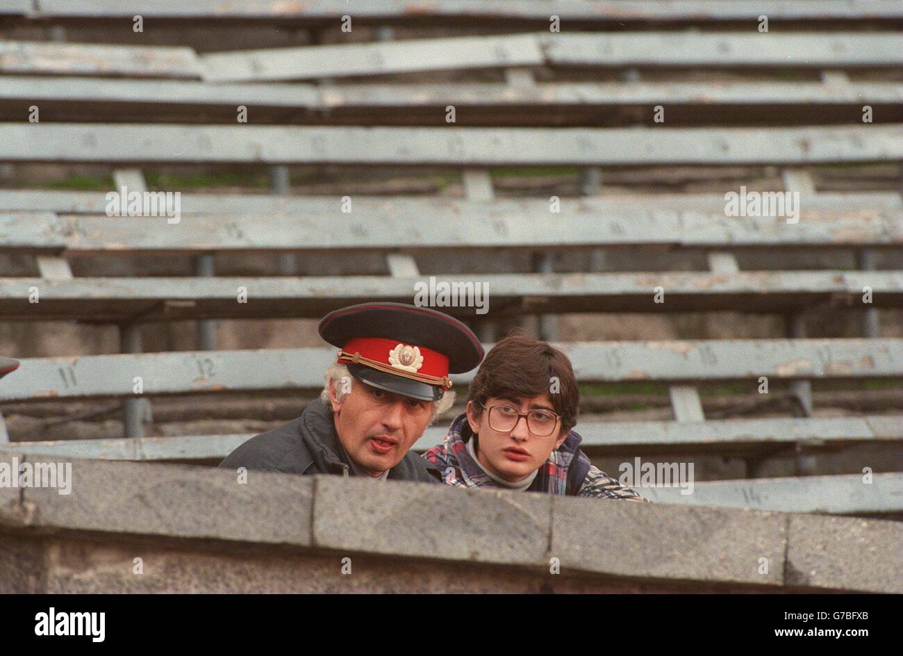 Soldier sits with lone fan in the empty stadium hi-res stock ...
