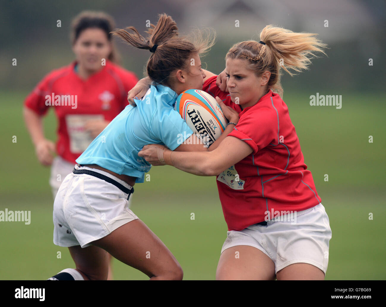 England Midland's Becca Herring and Wales A's Elli Norkett in action in ...