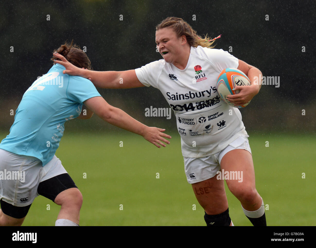 England London and South East's Sarah Bern hands off a tackle against ...