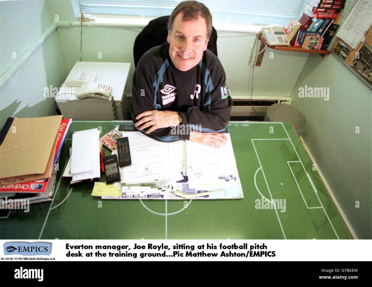 Sitting at his football pitch desk at the training ground hi-res stock ...