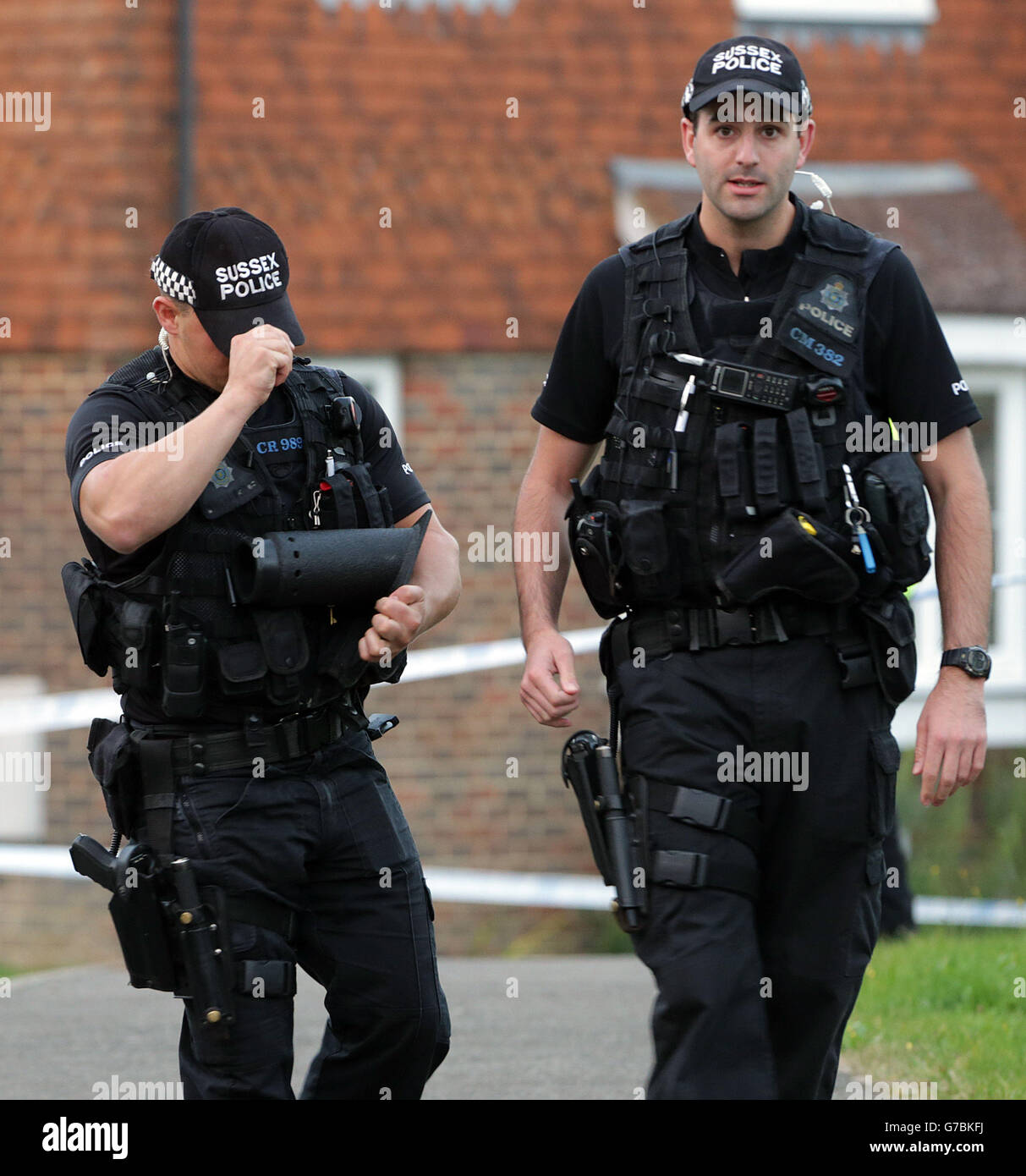 Armed police officers near the scene of a shooting in the village of ...