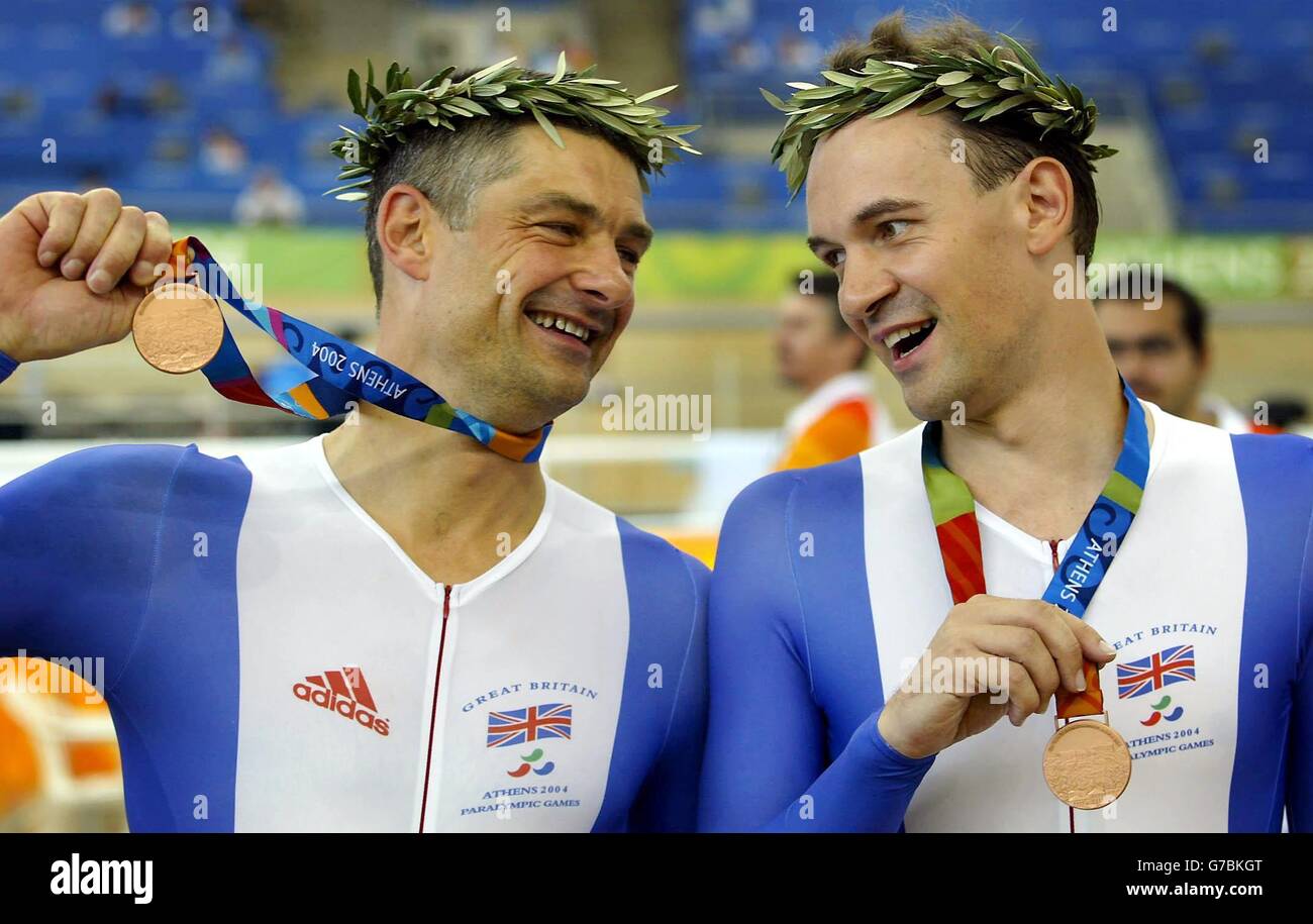 Great Britain's Ian Sharpe(right) with his guide Paul Hunter show off their bronze medals won ...
