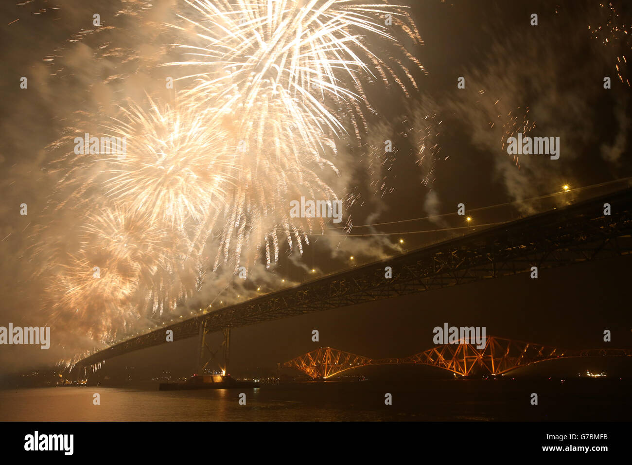 fireworks-go-off-above-forth-road-bridge-south-queensferry-hi-res-stock