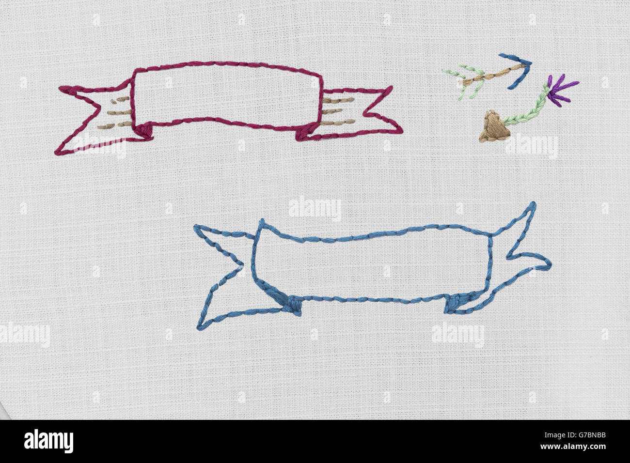 Two stiched banners with two arrows Stock Photo - Alamy