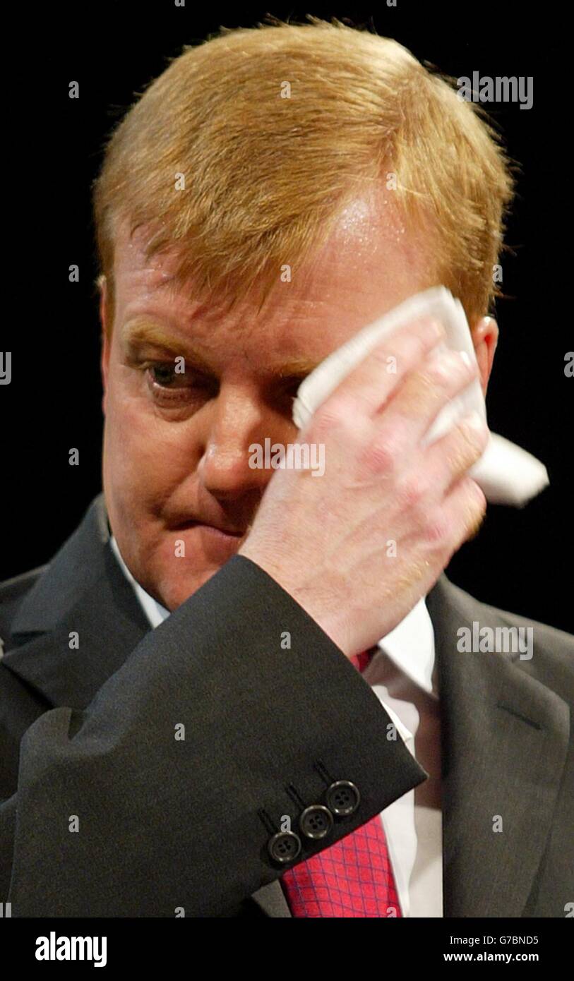 Liberal Democrat Party leader Charles Kennedy wipes sweat from his brow ...