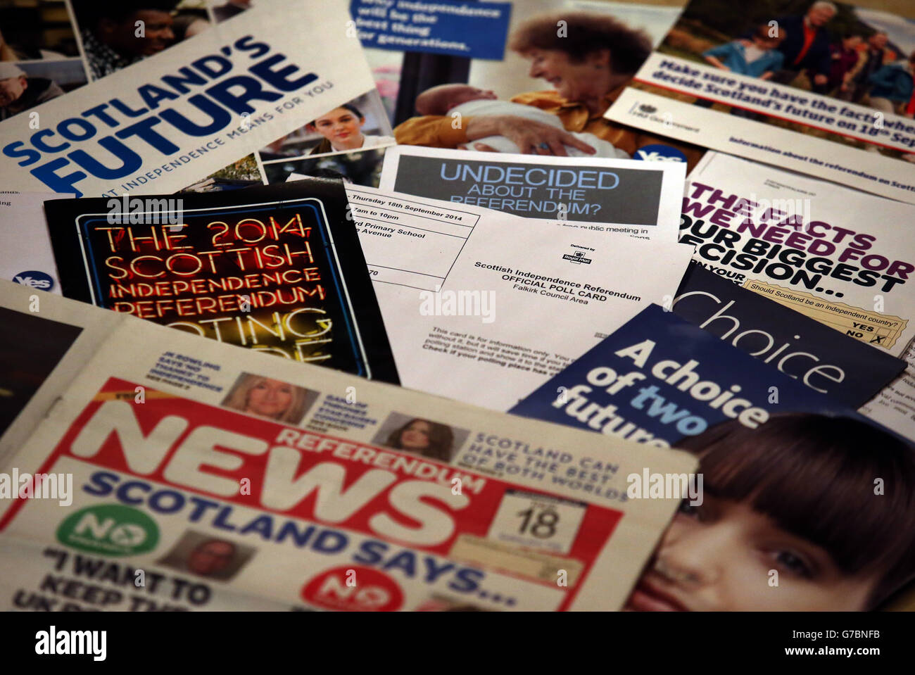 A Polling card sits with campaign material for the YES and NO sides in ...
