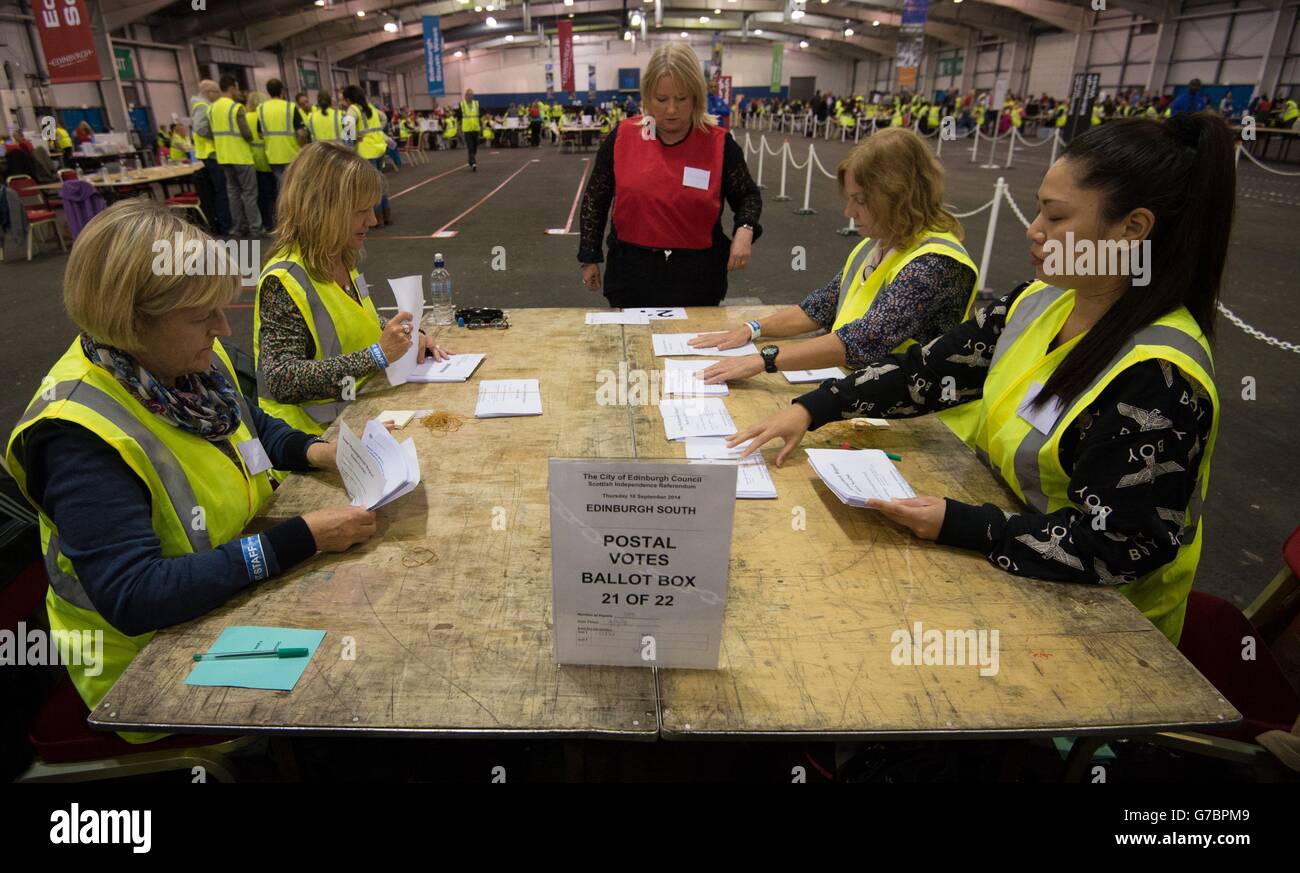 Volunteers begin to count the first postal ballots returned for the ...