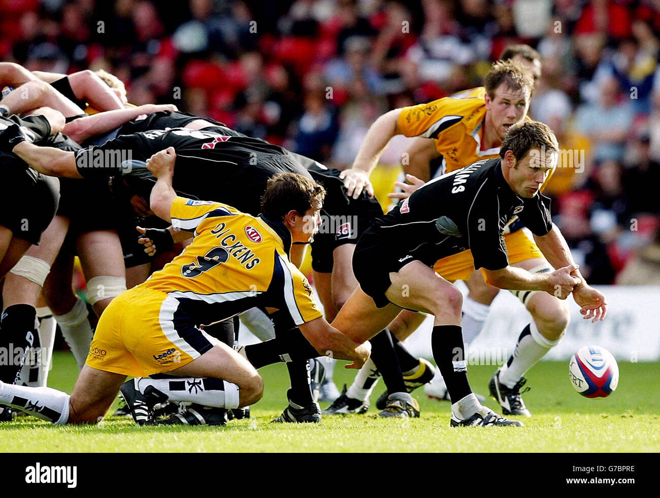 Saracens scrum half Morgan William is tackled by his opposite number ...