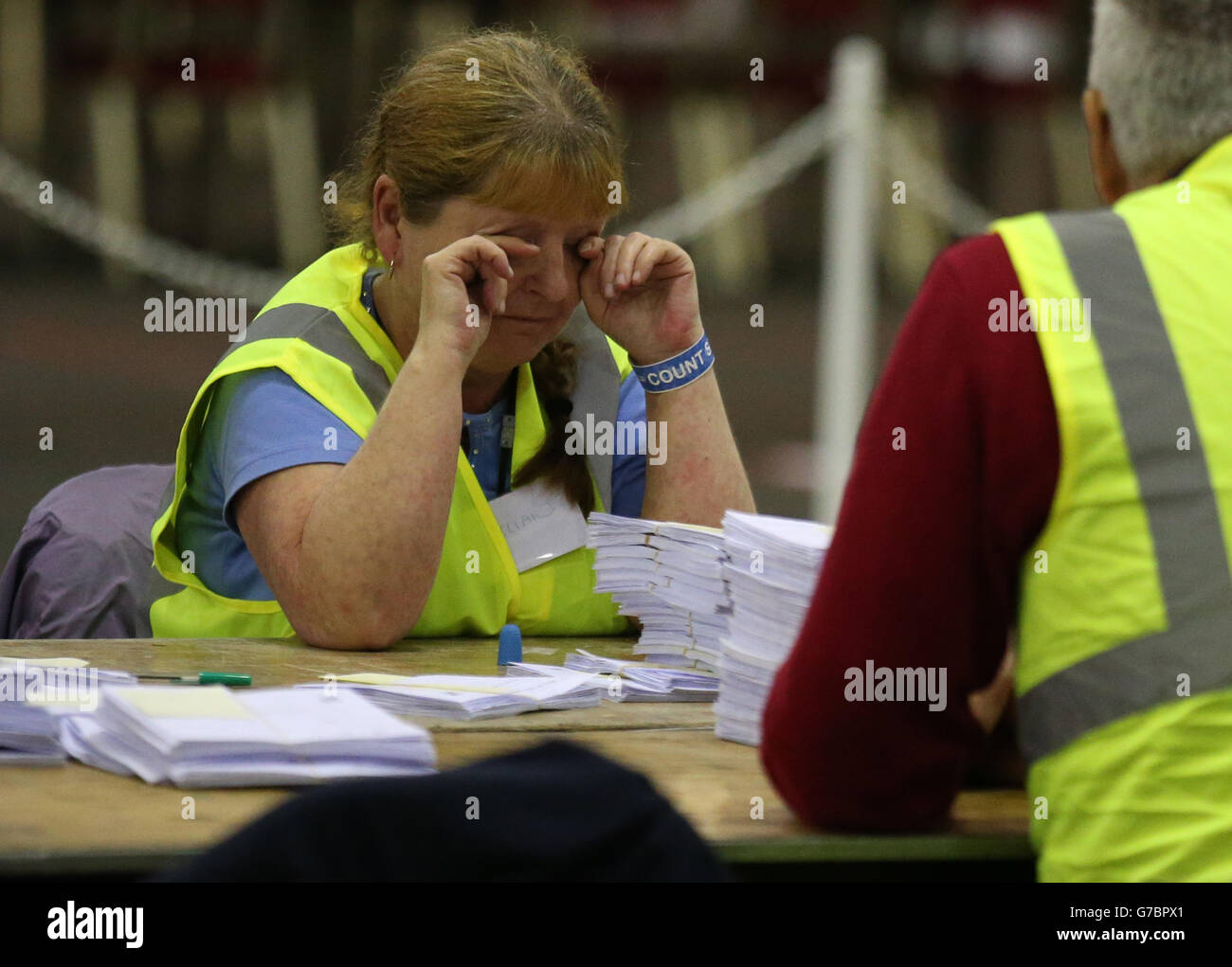 Counting staff yawn as they count ballot papers through the night at ...