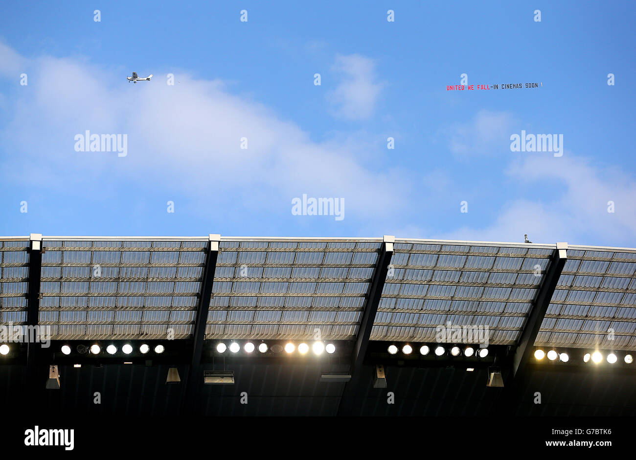 A plane flies a banner advertising the film United We Fall over the ...