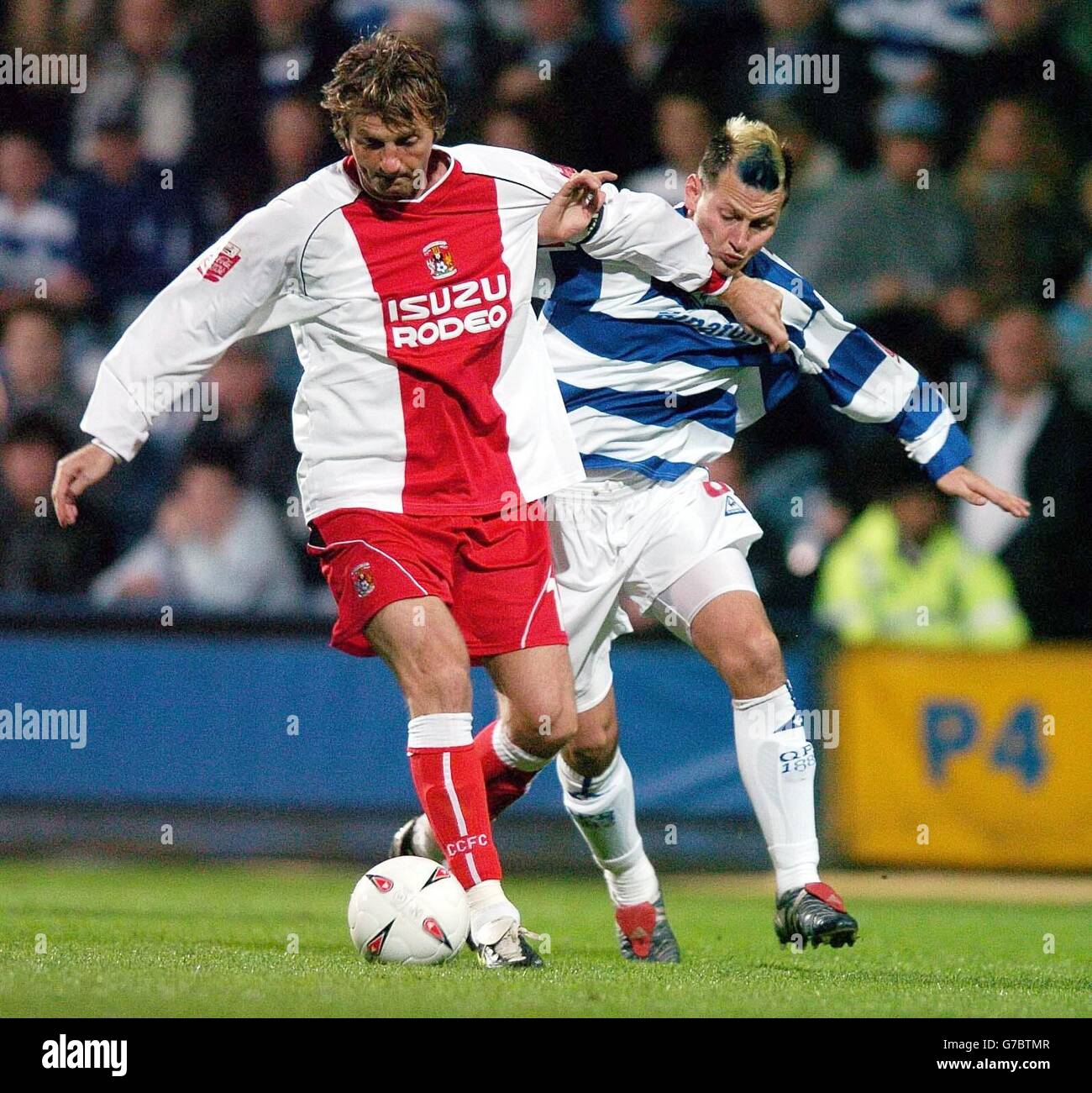 Queens Park Rangers' Marc Bircham tussles with Coventry City's Martin ...