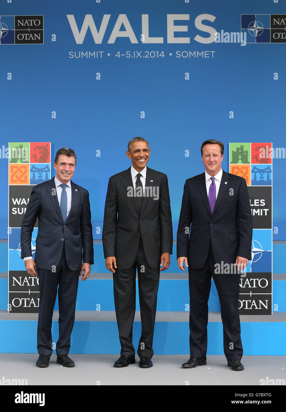 US President Barack Obama stands with NATO Secretary General Anders ...