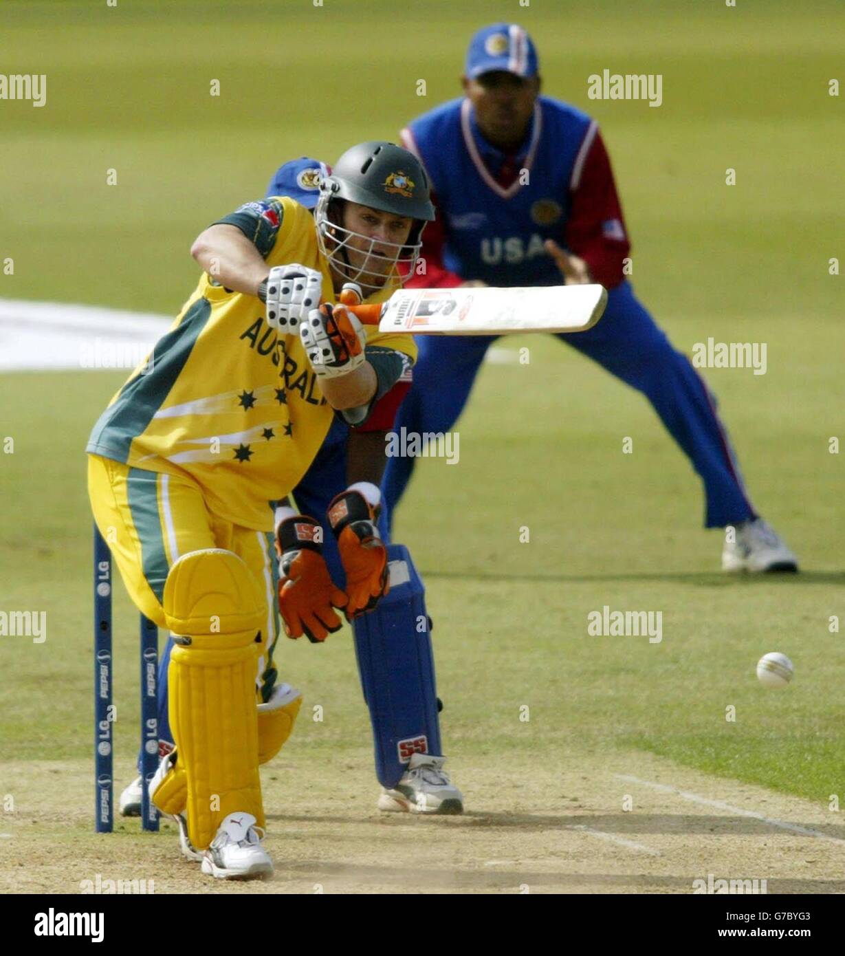 Australia's Adam Gilchrist smashes the ball away, as Australia ...