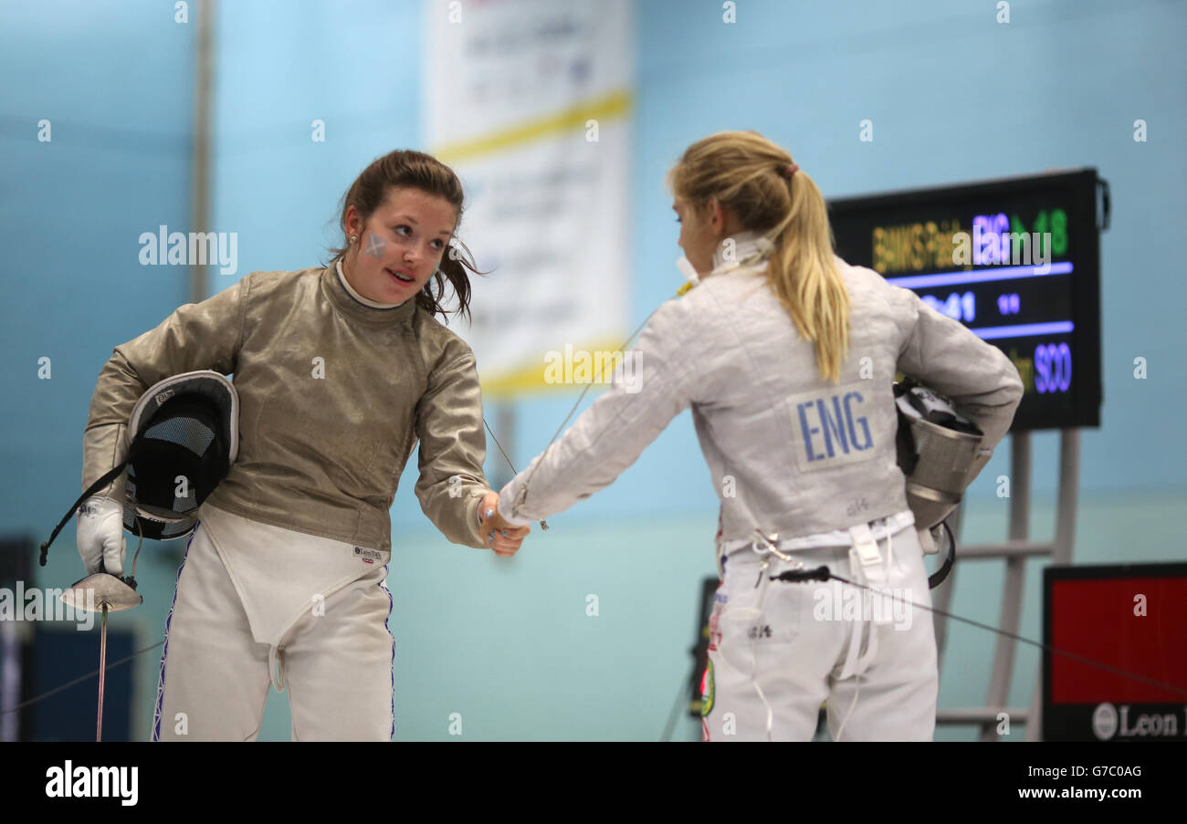 England's Paisley Banks (right) and Scotland's Sarah-Jane Hampson shake ...