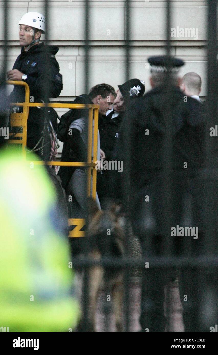 Hatch lowered ground two police officers in cherry picker hi-res stock ...